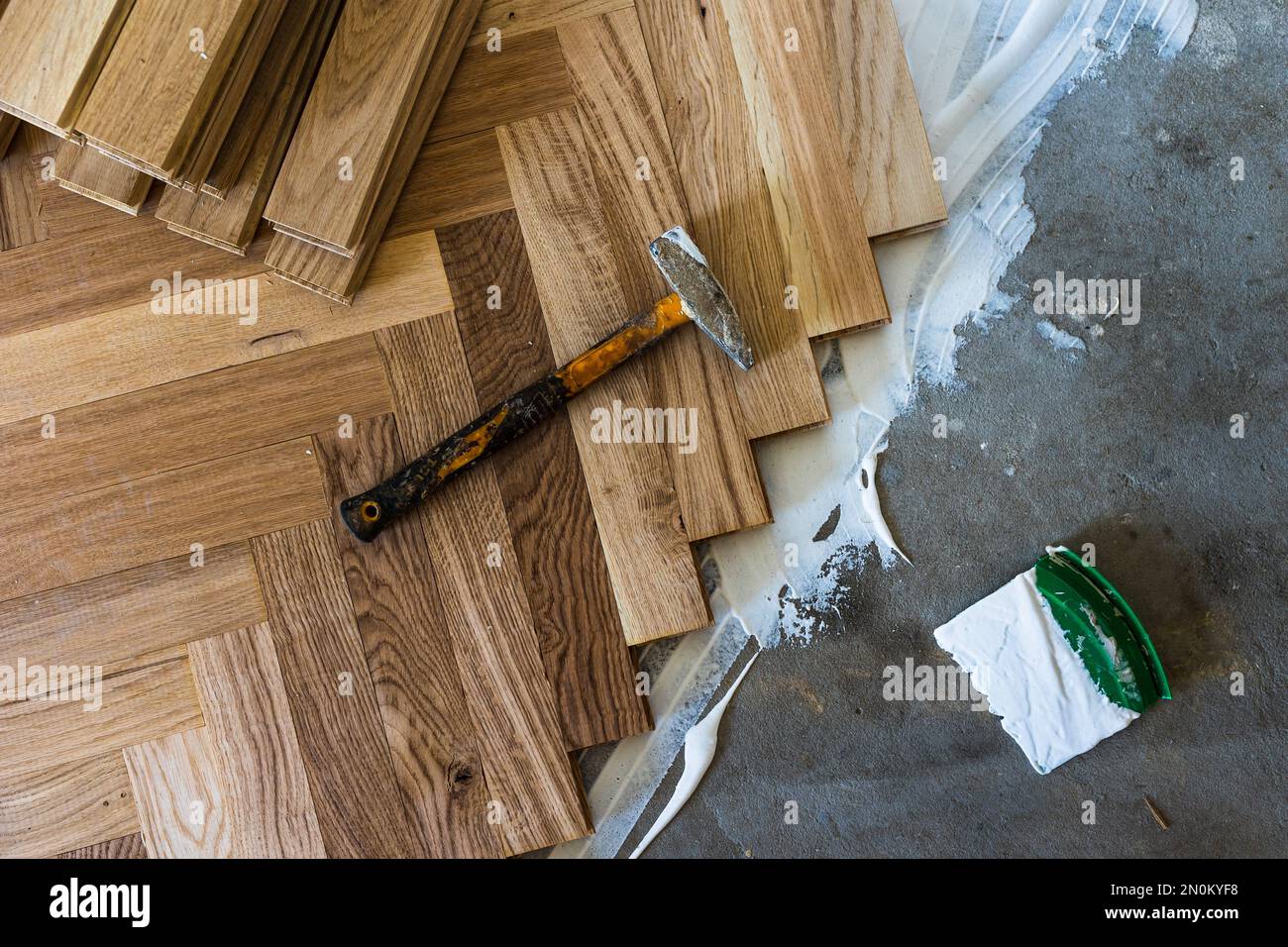 Top view of parquet boards installing in herringbone arrangement on ...