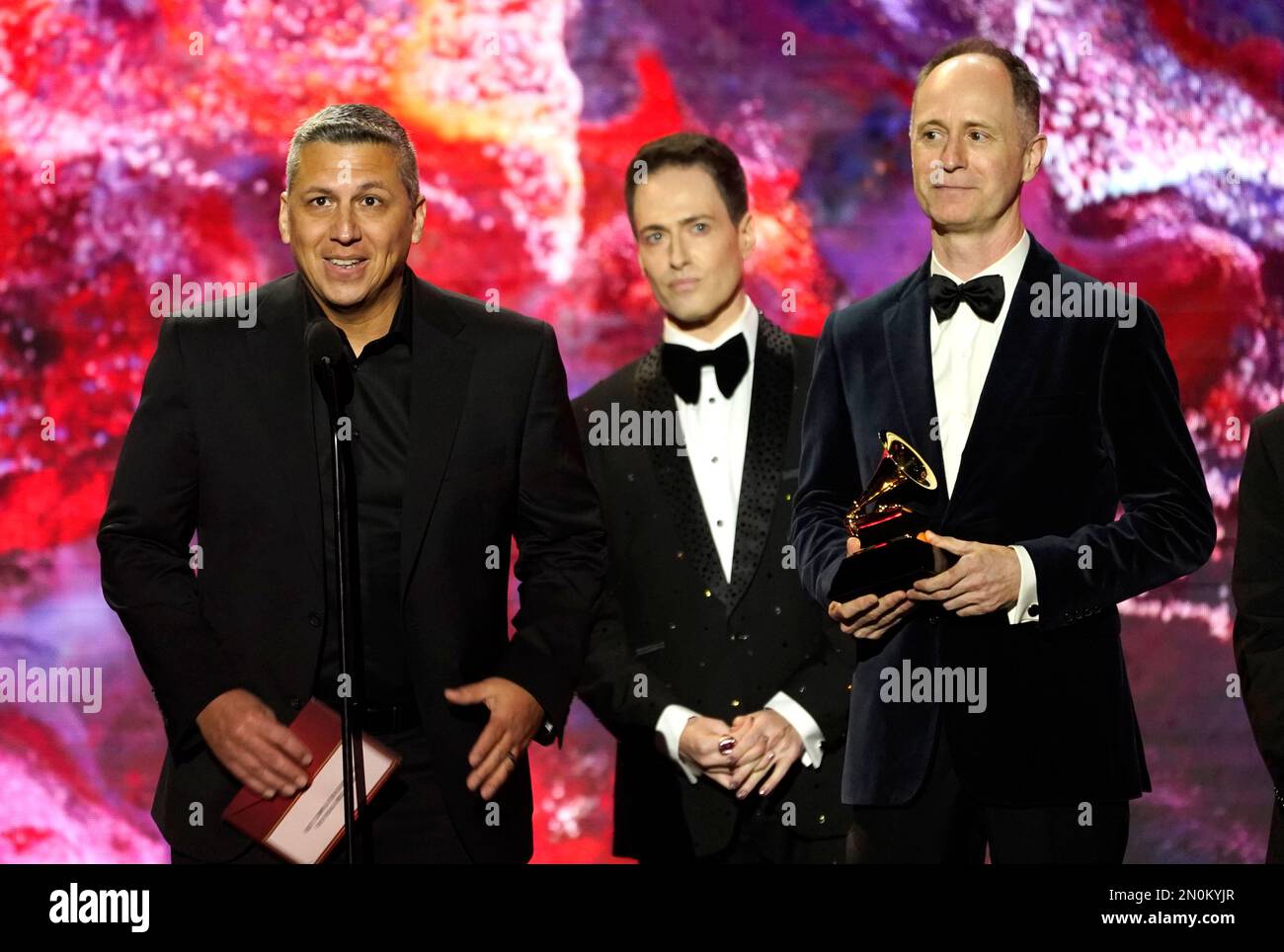 Mike Elizondo, left, and Tom MacDougall, right, accept the award for ...