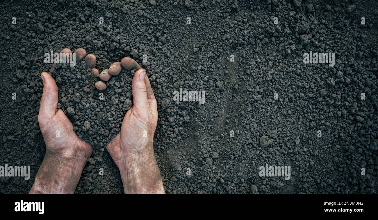 Symbol heart earth day. Handful of dirt hands heart shape. Farm organic ...