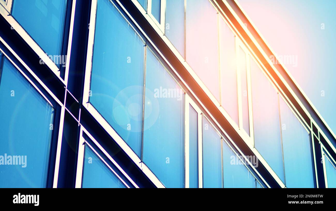 Modern building in the city with sunlight. Abstract texture and blue ...