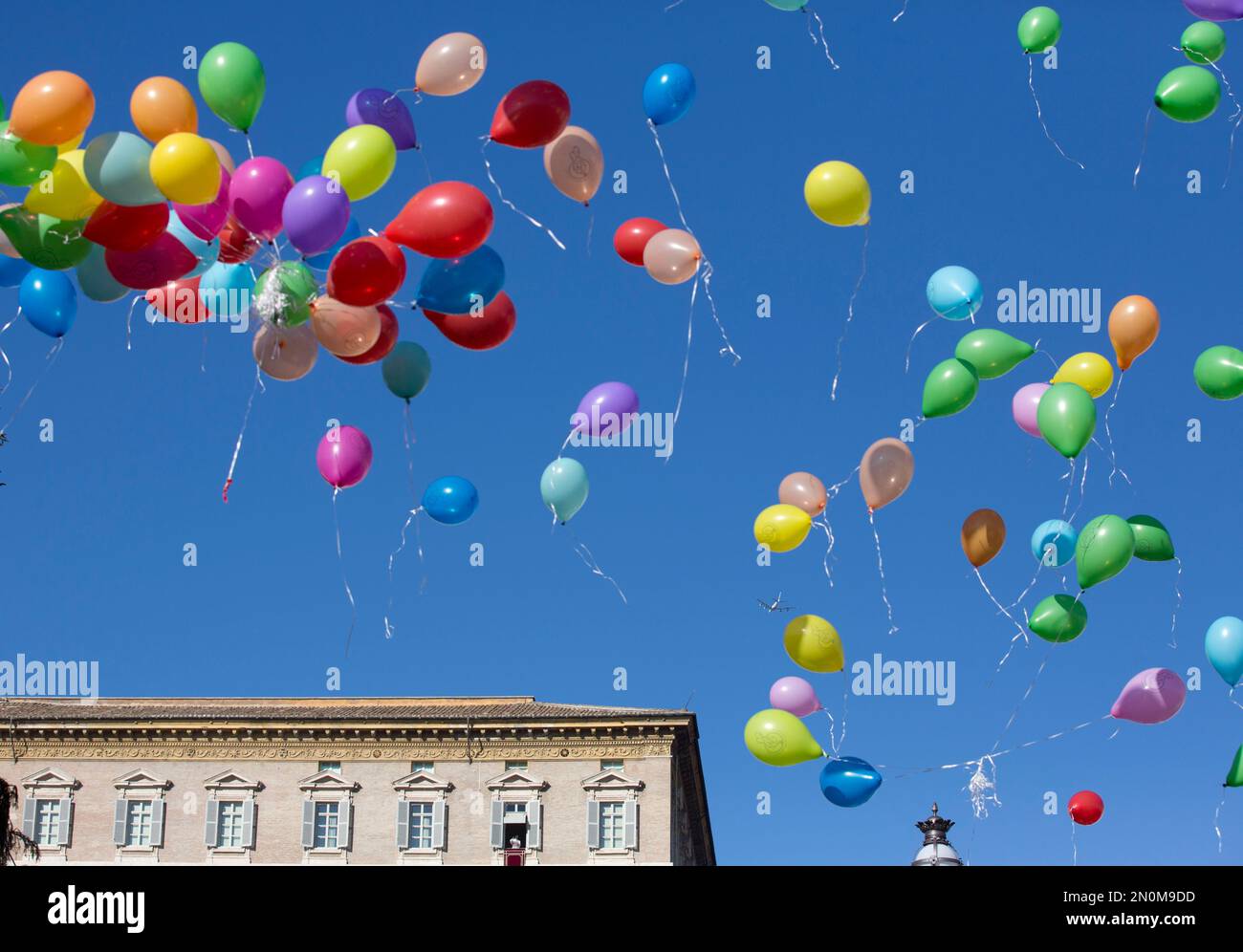 Balloons fly away as Pope Francis celebrates the Angelus prayer from ...