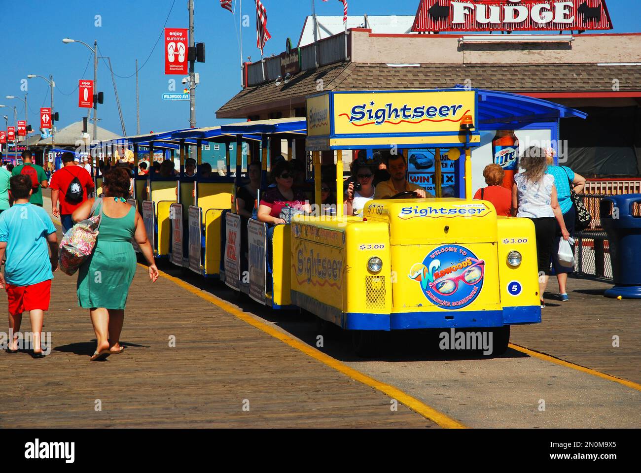 The tram car takes tourists for a ride on the Wildwood Boardwalk Stock Photo - Alamy