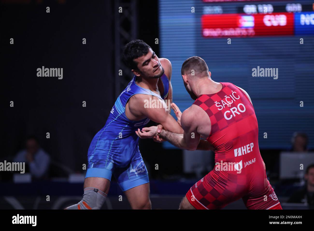 ZAGREB, CROATIA - FEBRUARY 05: Filip Sacic of Croatia (red) competes ...