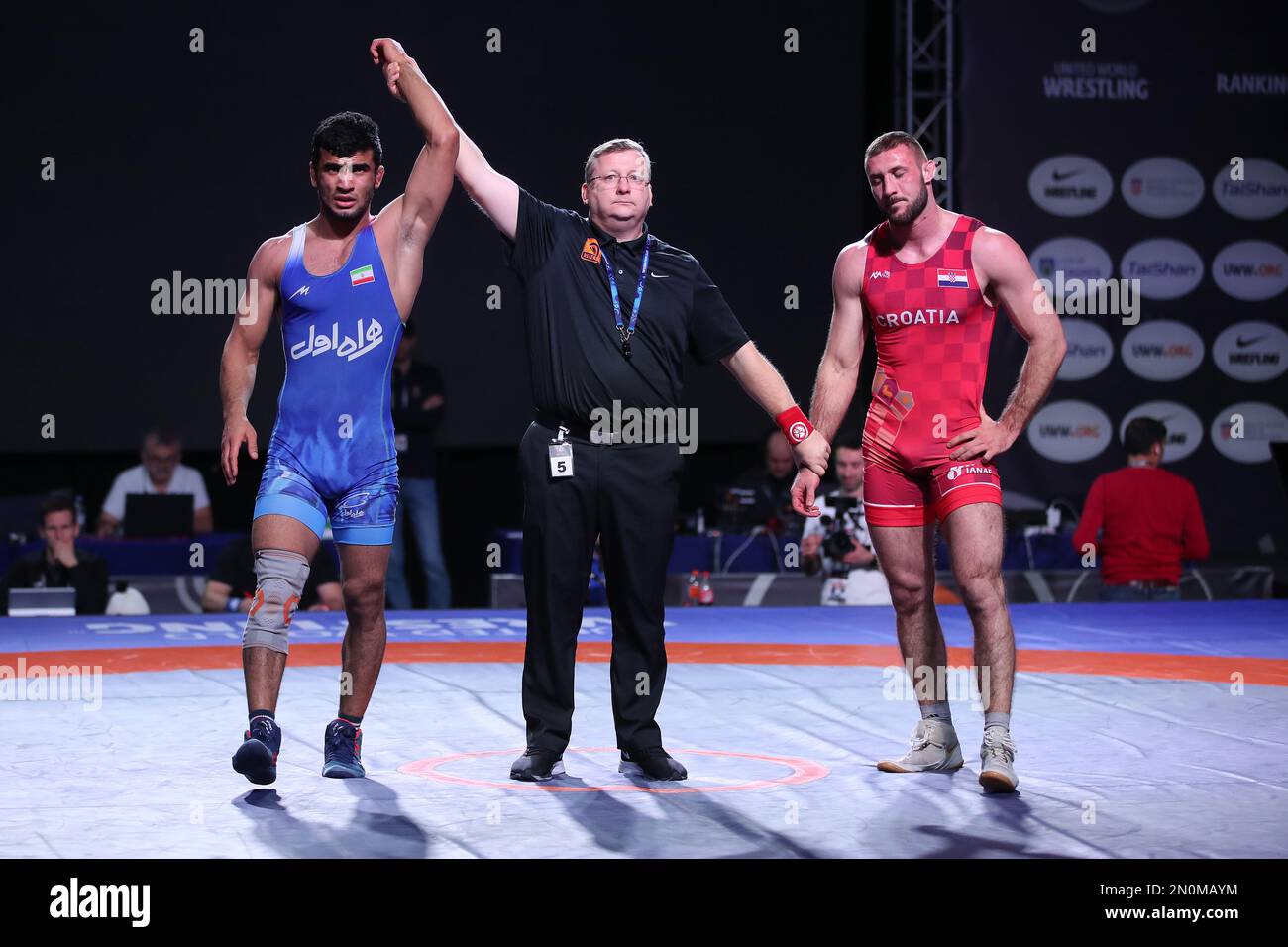ZAGREB, CROATIA - FEBRUARY 05: Filip Sacic of Croatia (red) competes ...