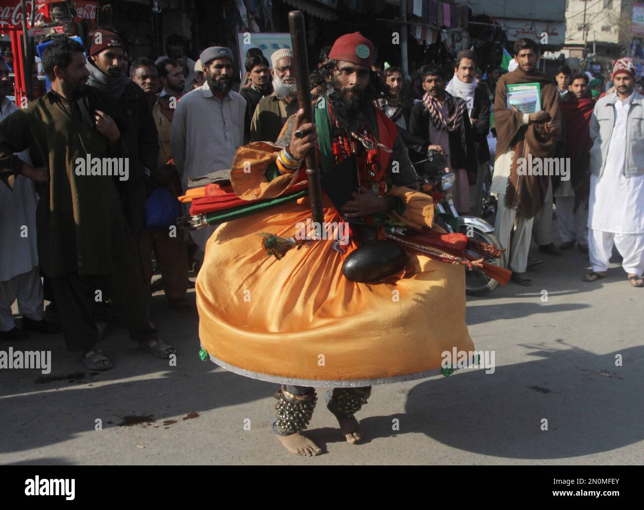 A Muslim Pakistani malang or devotee dances to celebrate the Eid Milad ...