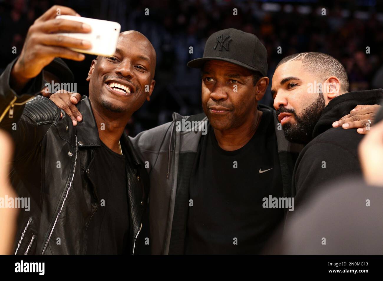 Tyrese Gibson, from left, Denzel Washington and Drake take a selfie at ...
