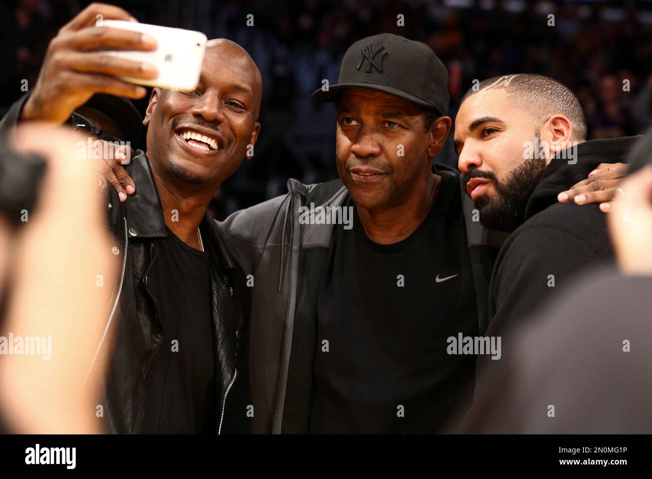 Tyrese Gibson, from left, Denzel Washington and Drake take a selfie at ...