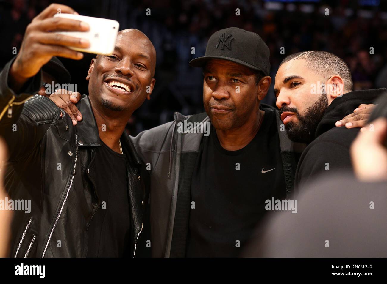 Tyrese Gibson, from left, Denzel Washington and Drake take a selfie at ...