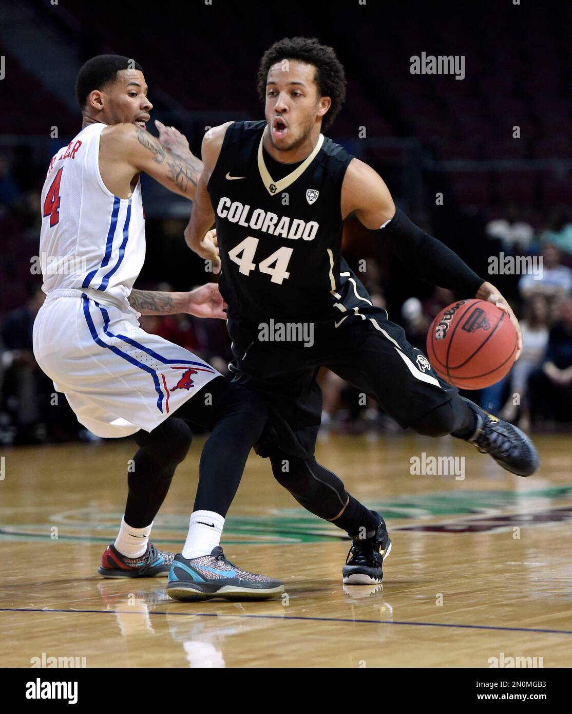 Colorado guard Josh Fortune (44) drives the ball around SMU's Keith ...