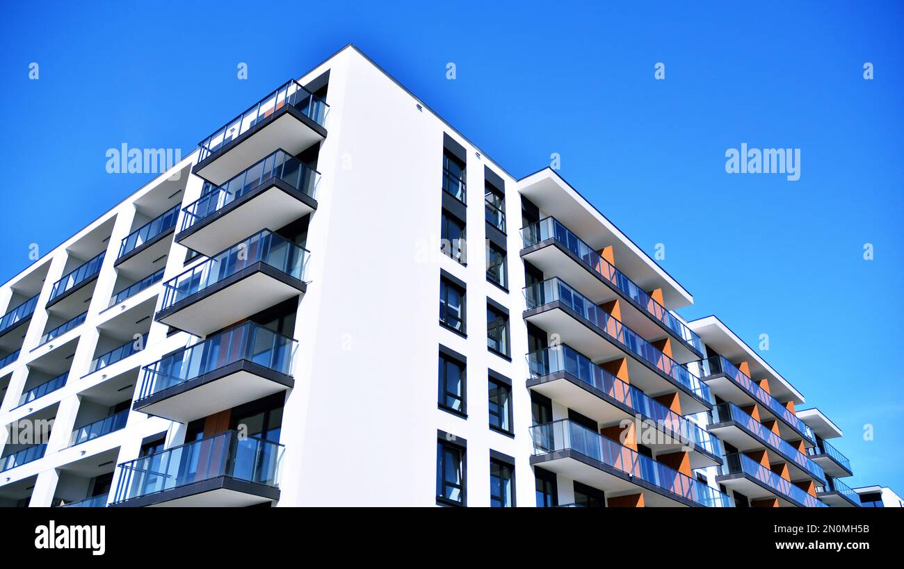Condominium and apartment building with symmetrical modern architecture ...