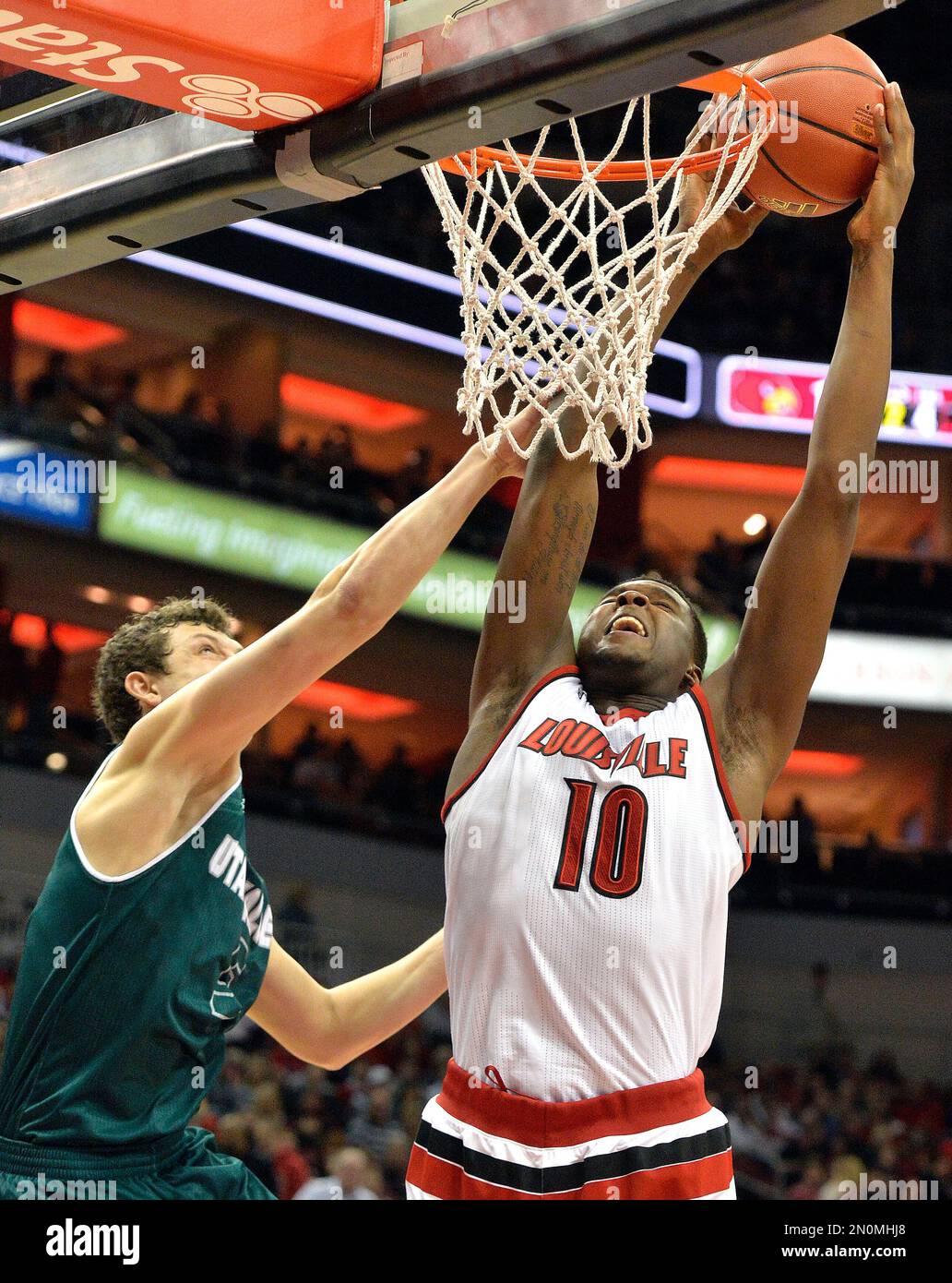 Louisville's Jaylen Johnson (10) goes in for a dunk past Utah Valley's ...