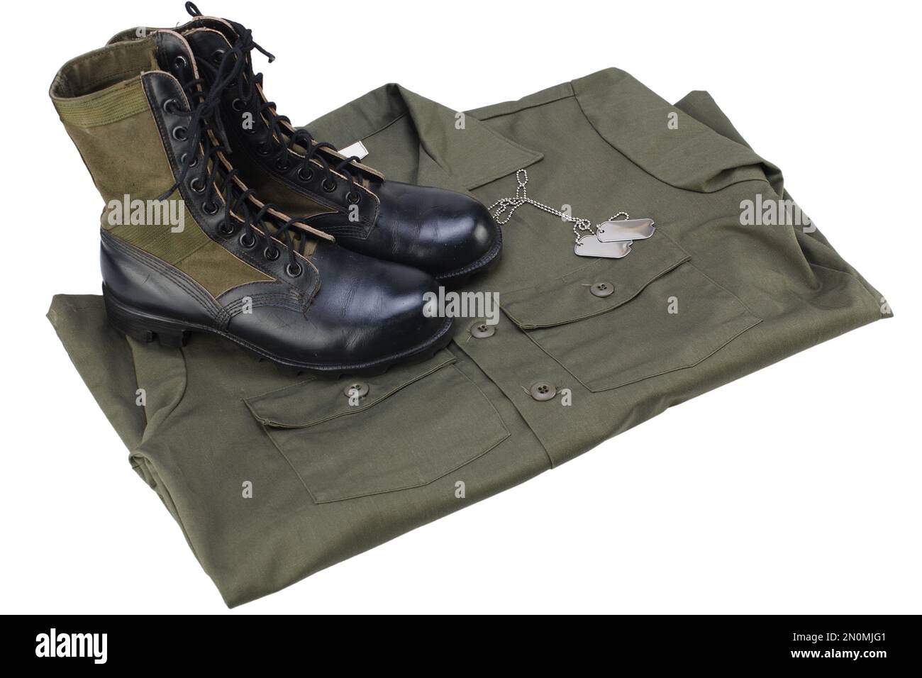 US army utility uniforms shirt and jungle boots with dog tags isolated ...