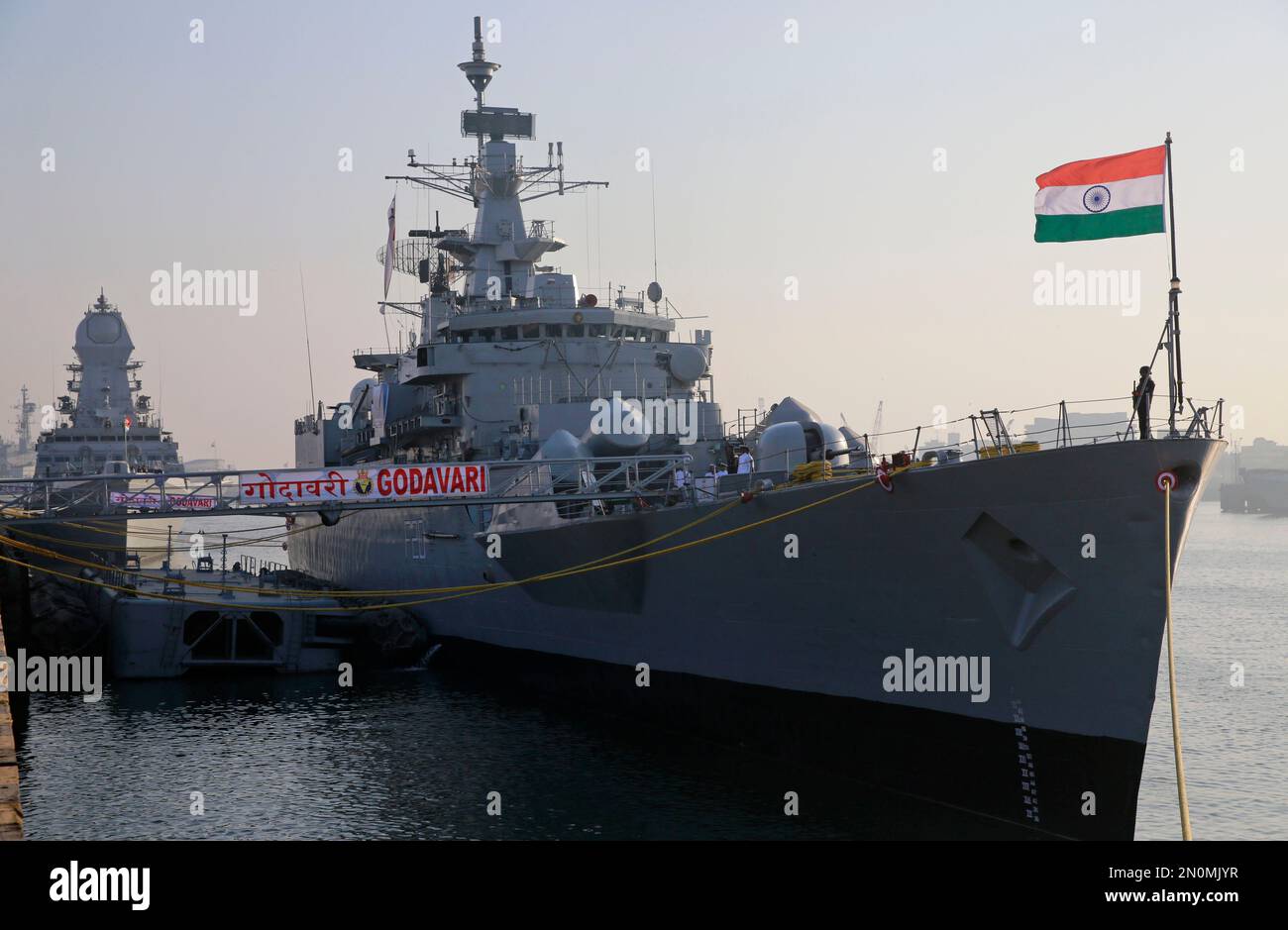 Indian navy personnel stand on board war ship Godavari during its ...
