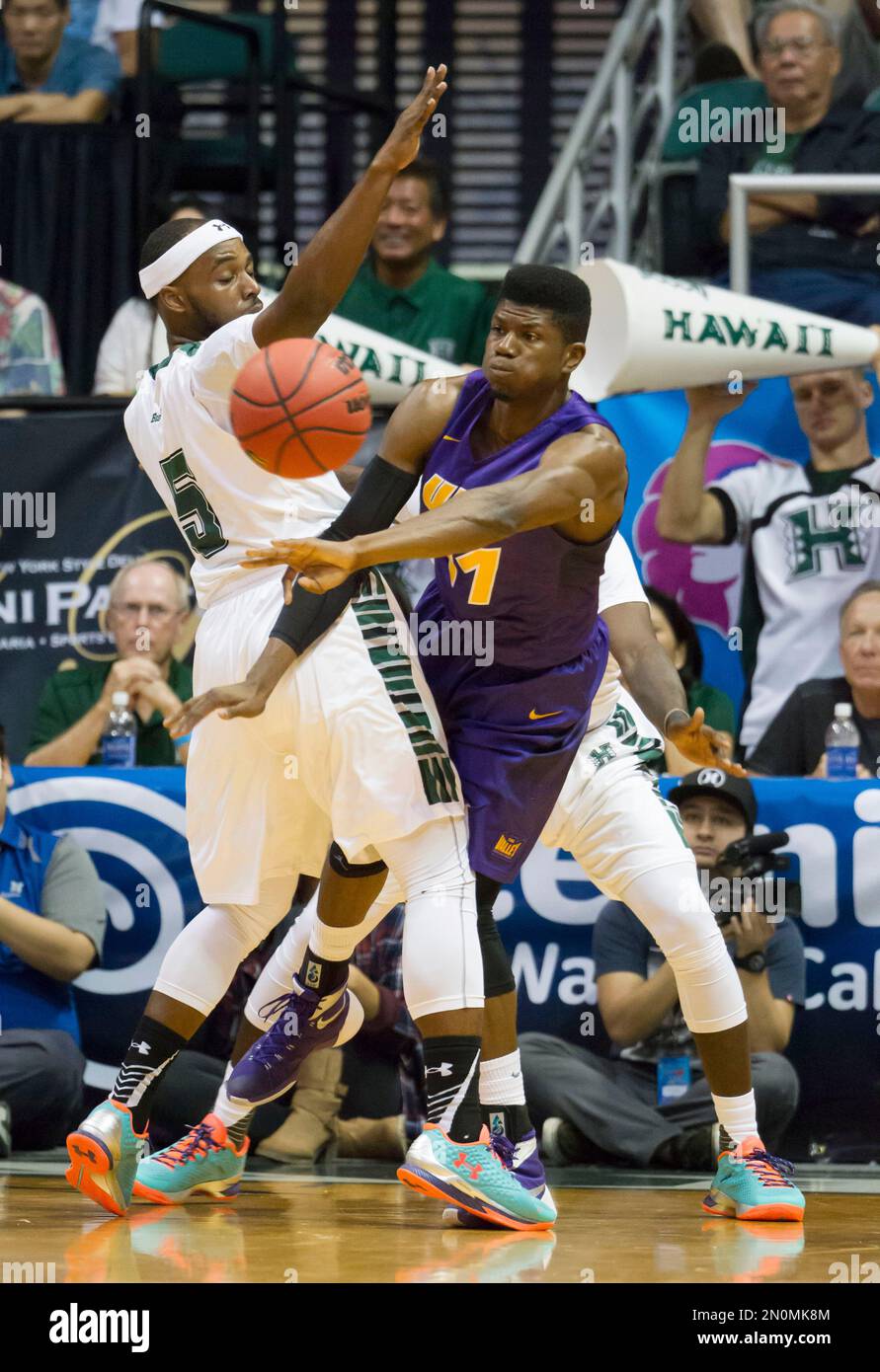 Northern Iowa guard Wes Washpun, right, passes off the basketball while ...