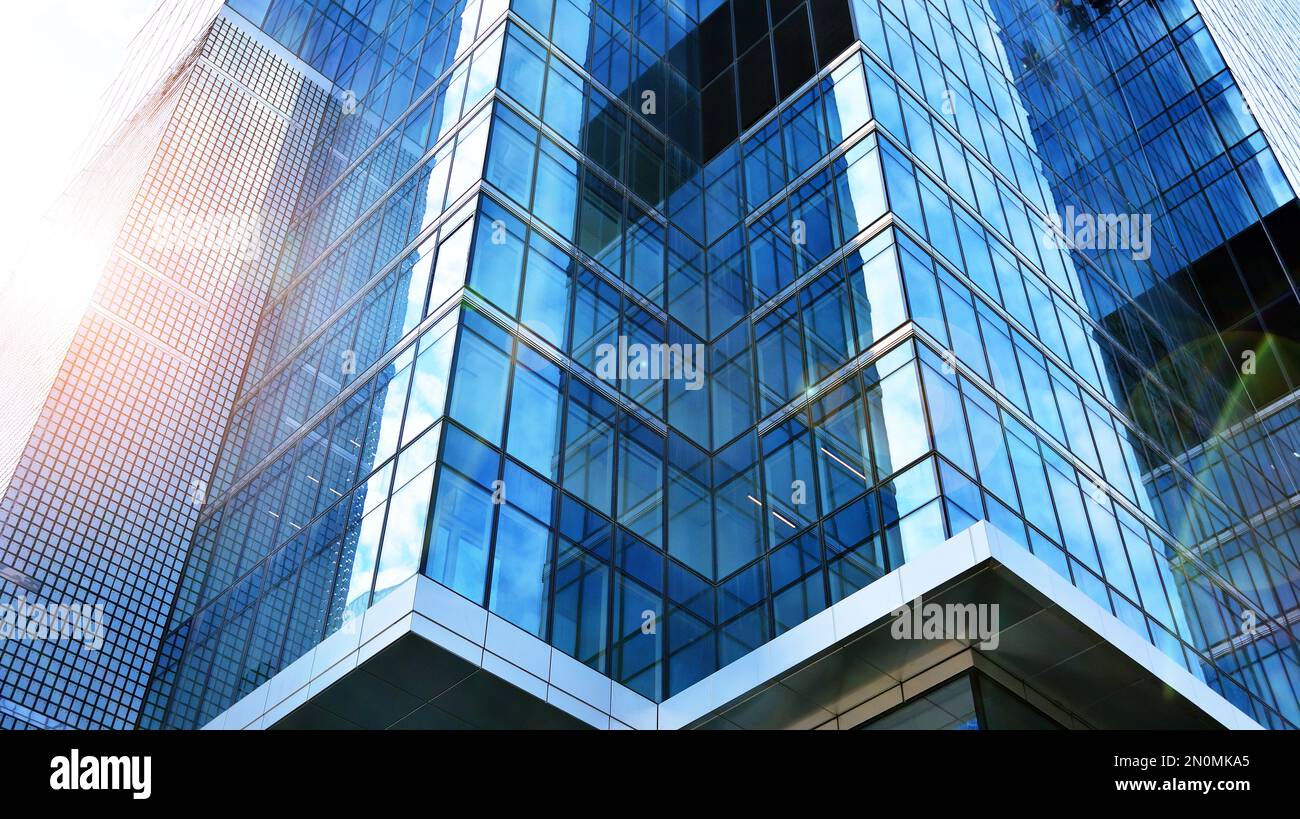 Modern office building with glass facade on a clear sky background ...