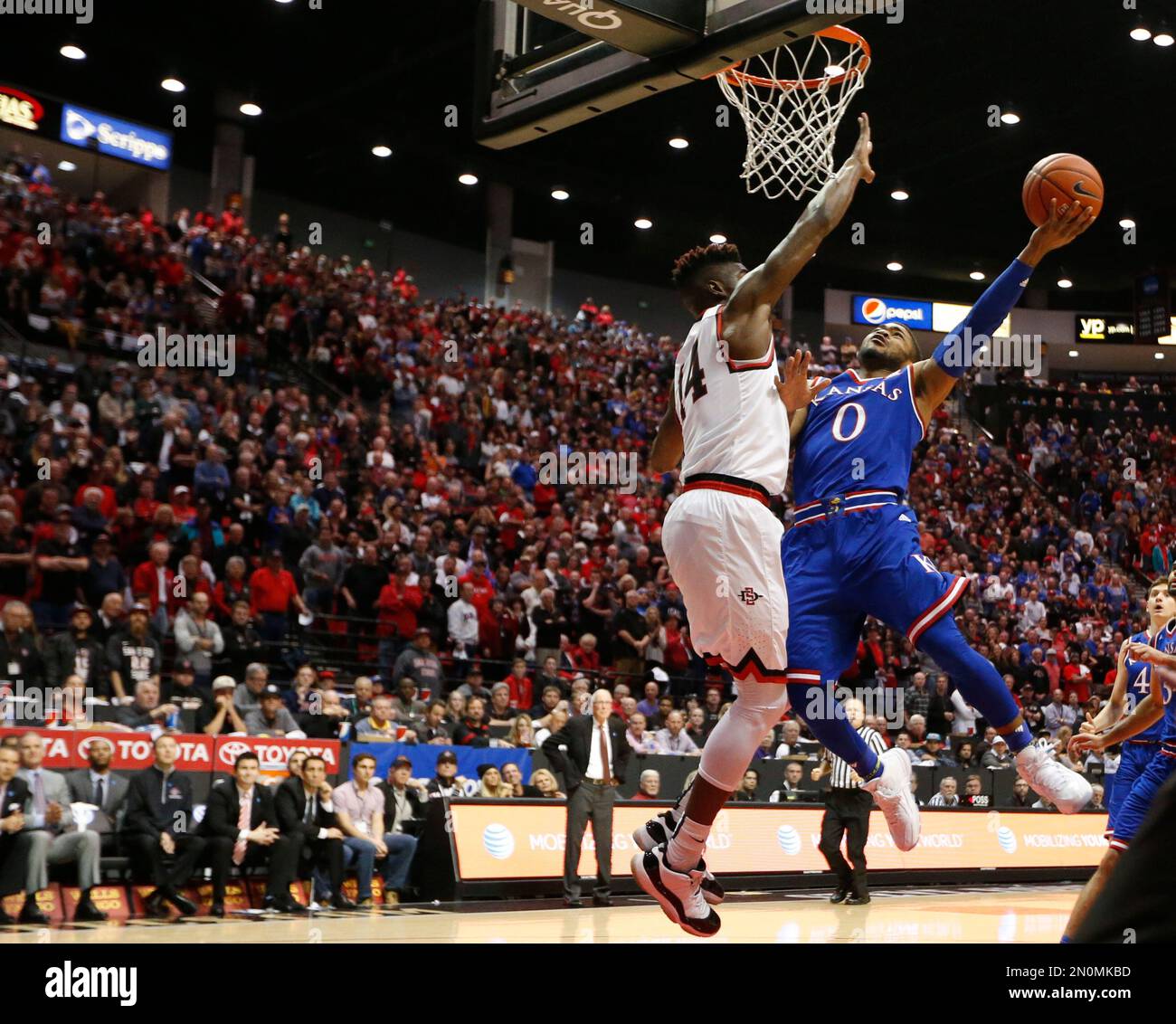 Kansas guard Frank Mason III scores against the defense of San Diego ...