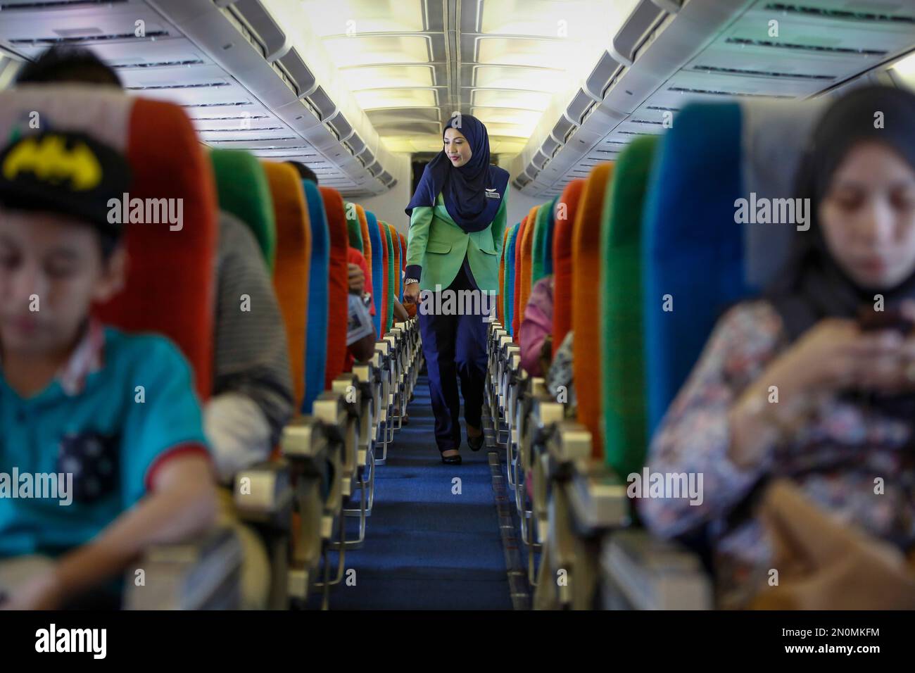 In this Dec. 22, 2015, photo, a Rayani Air flight crew walks down the ...