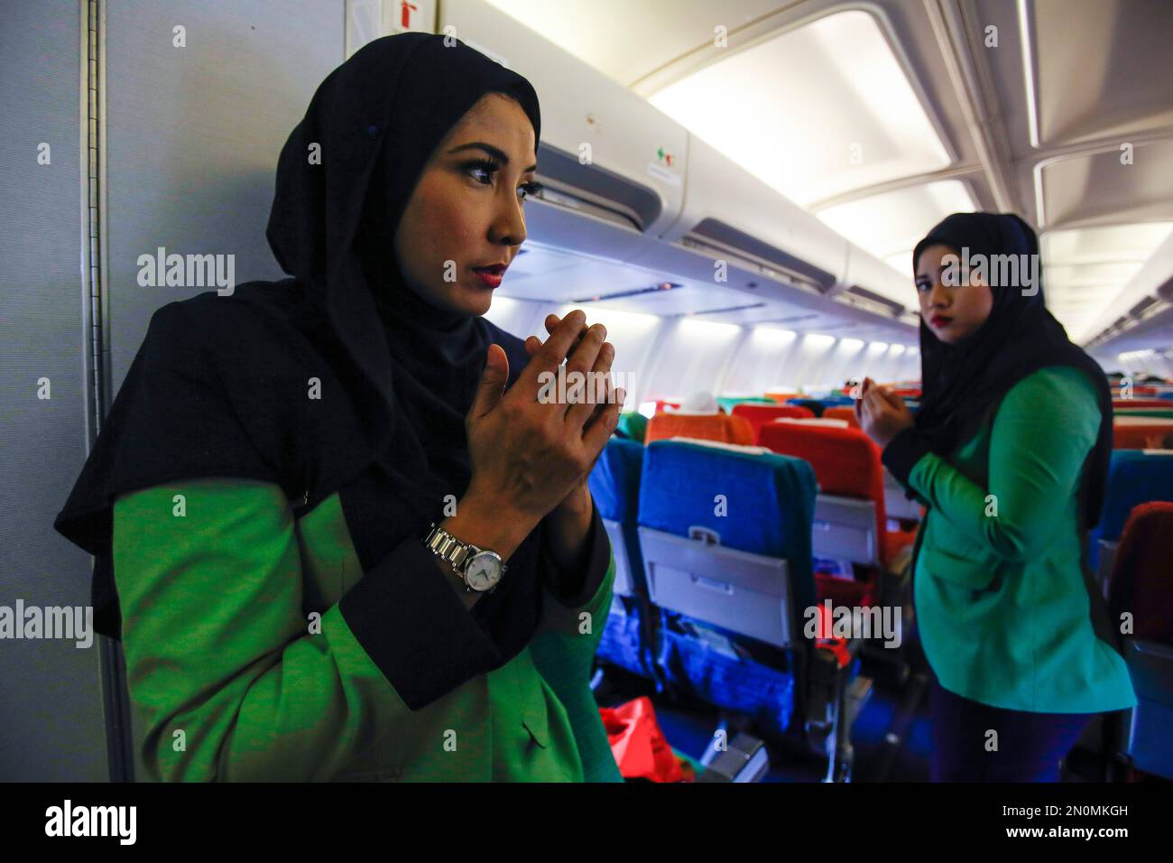 In this Dec. 22, 2015, photo, Rayani Air flight crews prays before ...