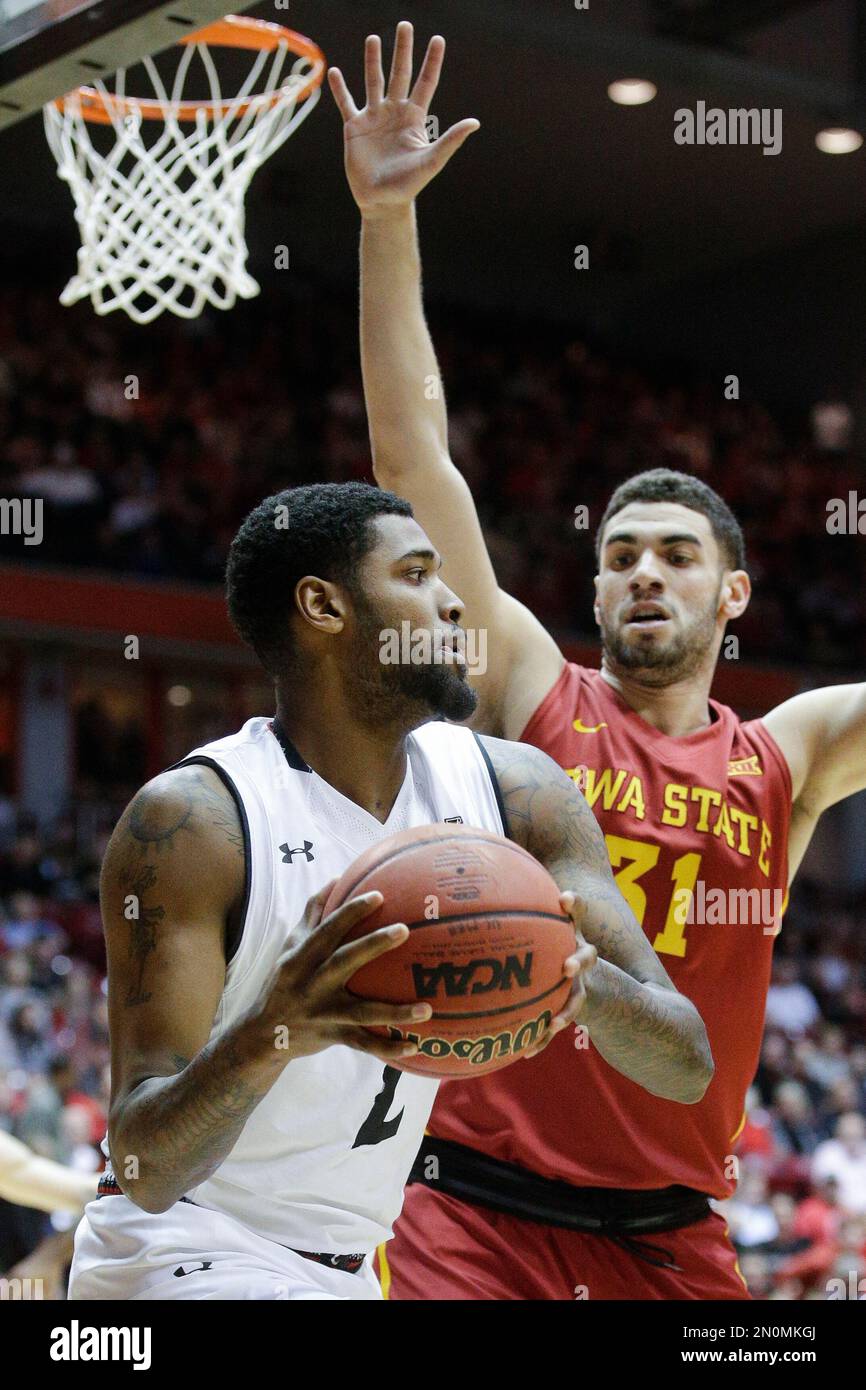 Cincinnati's Octavius Ellis (2) looks to pass around Iowa State's ...
