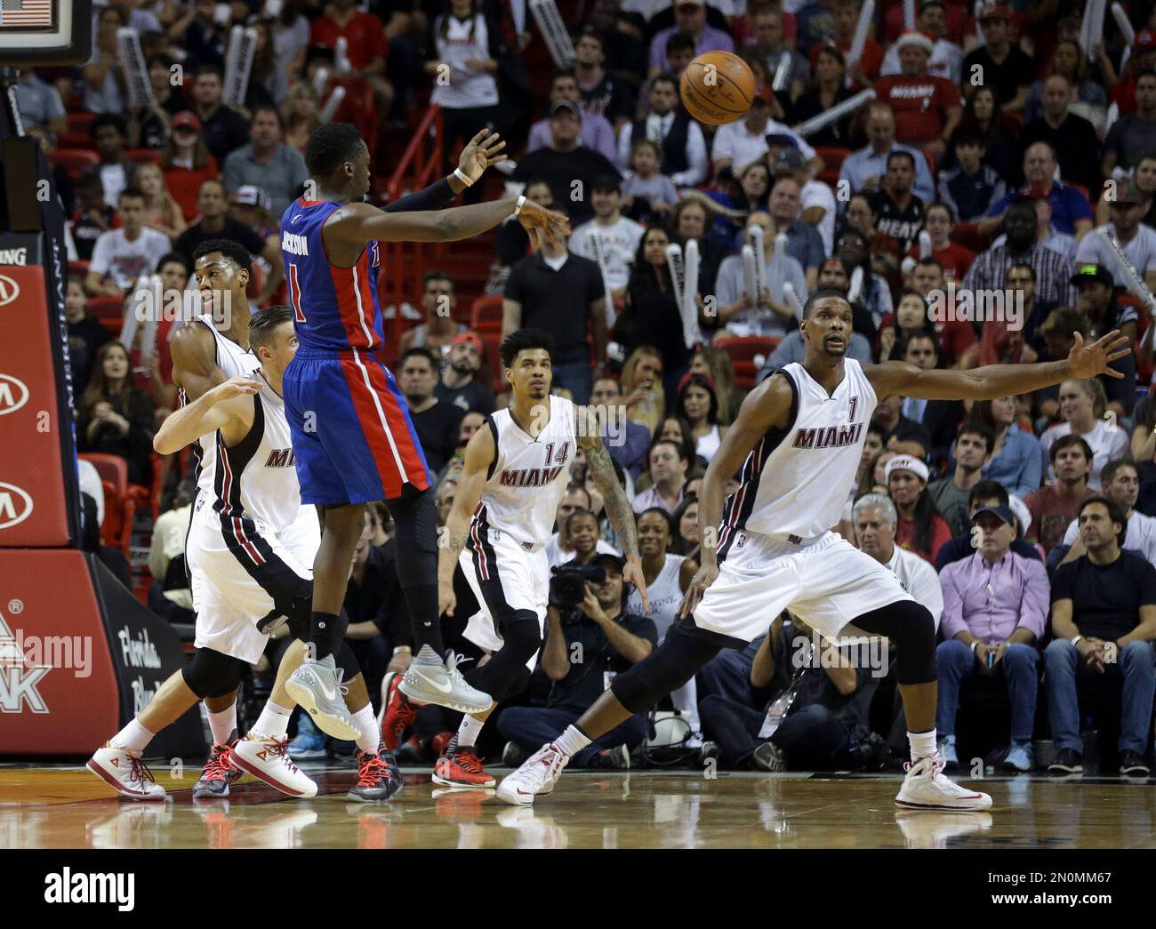 Detroit Pistons' Reggie Jackson (1) passes as Miami Heat's Gerald Green ...