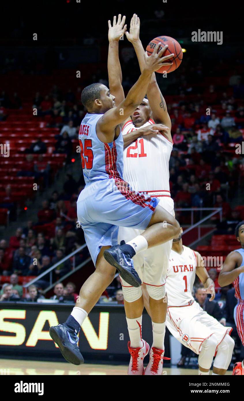 Delaware State guard Todd Hughes (35) goes to the basket as Utah ...