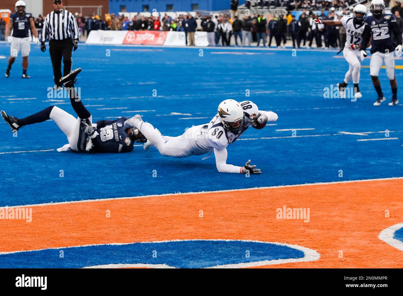 Akron wide receiver Andrew Pratt (80) stretches for extra yards during ...