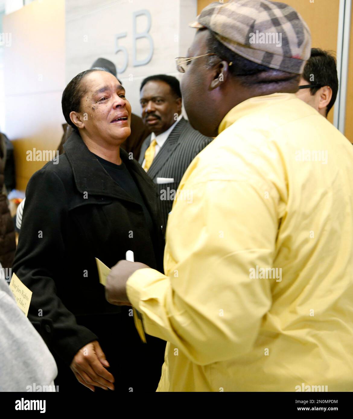 Rev. Reginald Holmes, right, talks with Stephanie Burke after a Denver ...