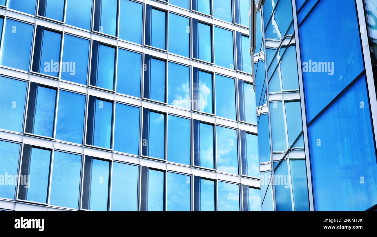 Modern office building with glass facade on a clear sky background ...