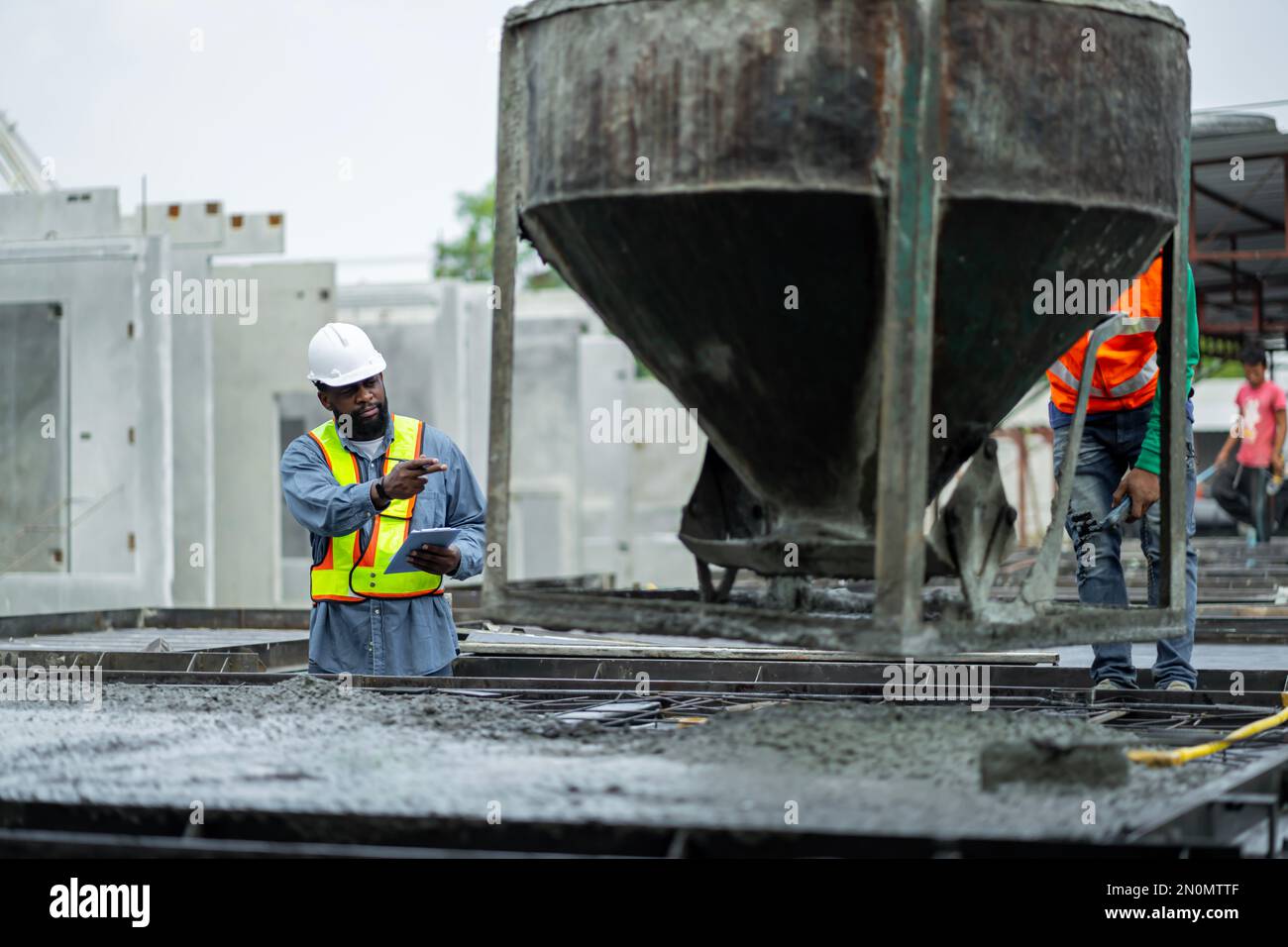 Male engineers are inspecting and controlling the work of the employees ...