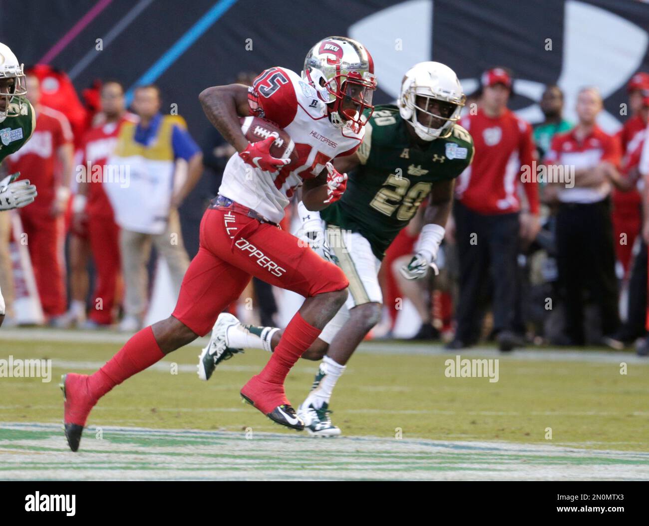 Western Kentucky wide receiver Nicholas Norris (15) runs past South Florida cornerback Devin ...