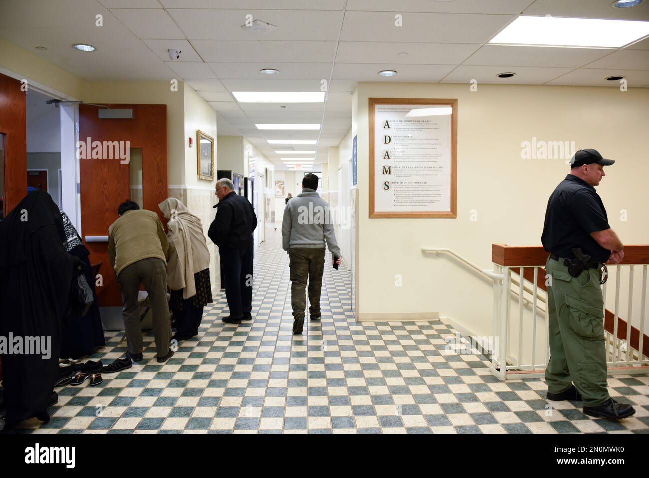 An armed private security guard stands in the hallway at the All Dulles ...