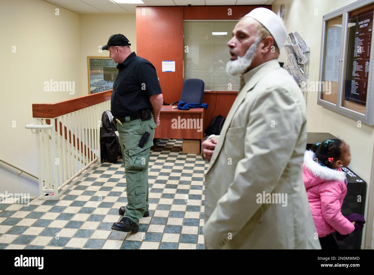An armed private security guard stands in the hallway at the All Dulles ...