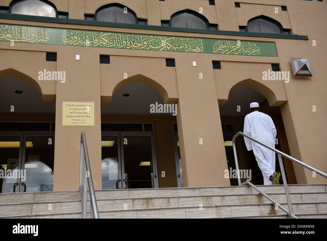 A member of the congregation arrives for Jum'a, the Friday prayer, at ...