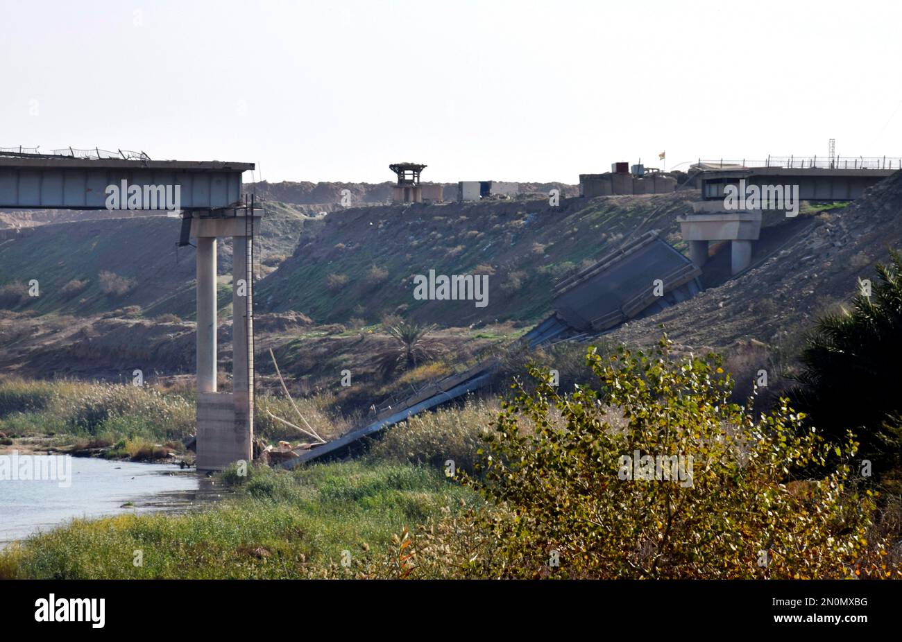 This photo shows a bridge destroyed by the Islamic State group to block ...