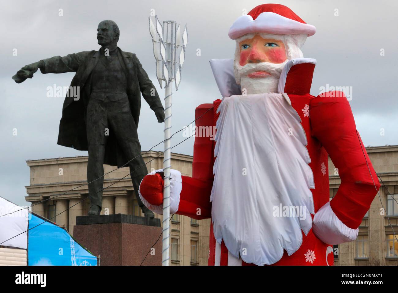 A figure of Ded Moroz (Grandfather Frost) is installed next to a statue ...
