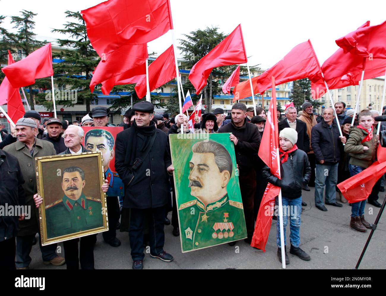 Georgians carry portraits of former Soviet dictator Joseph Stalin and ...