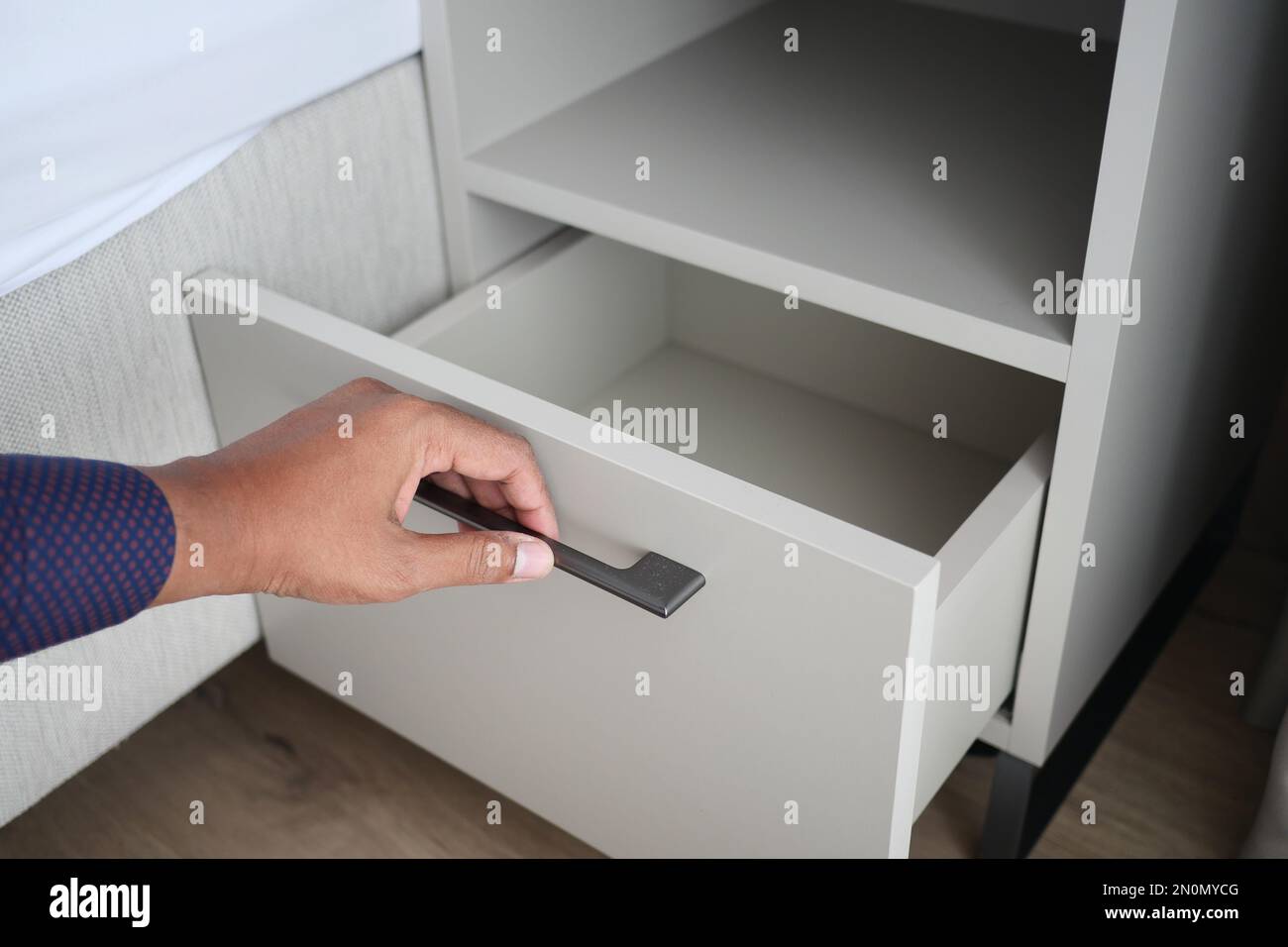 man's hand open drawer wooden in cabinet Stock Photo - Alamy