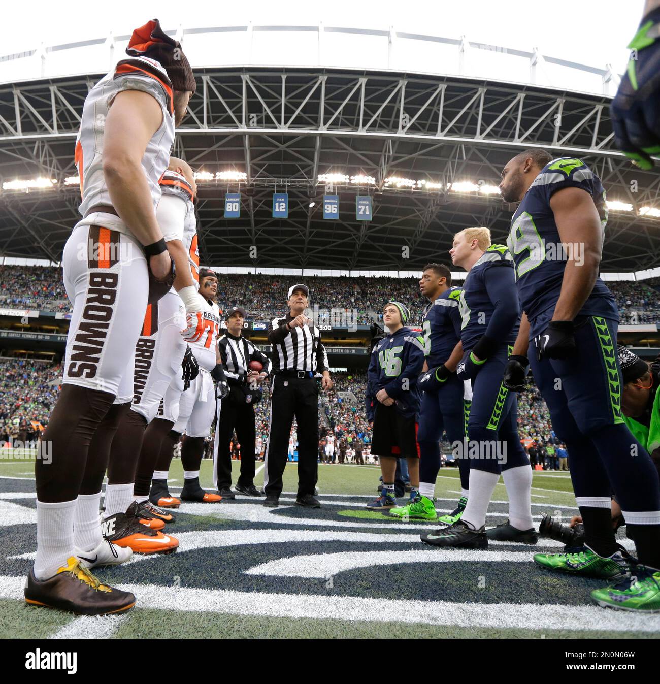 Referee Gene Steratore, center, flips the coin before an NFL football ...