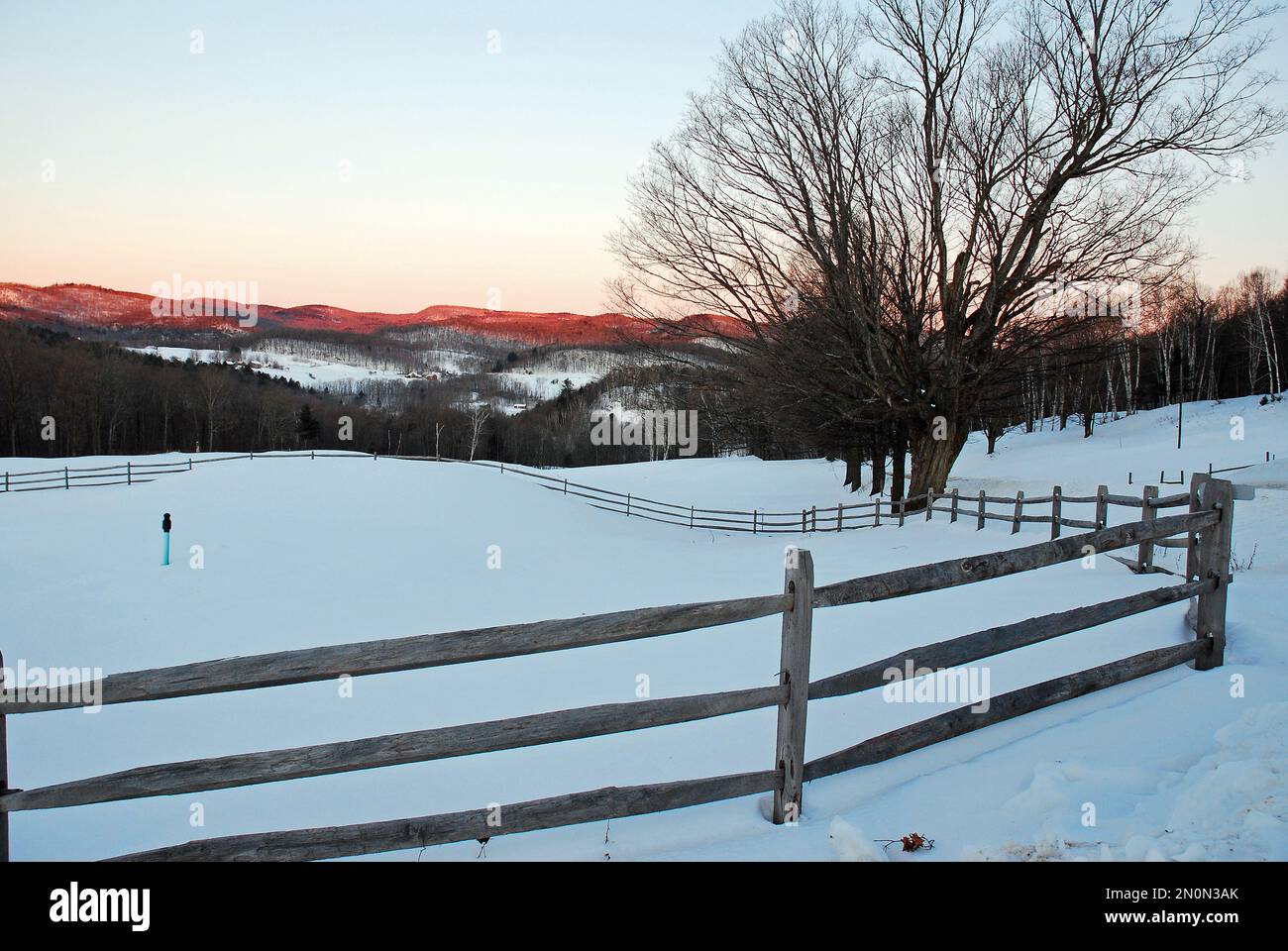 The sun rises on a rural winter scene in Vermont Stock Photo - Alamy