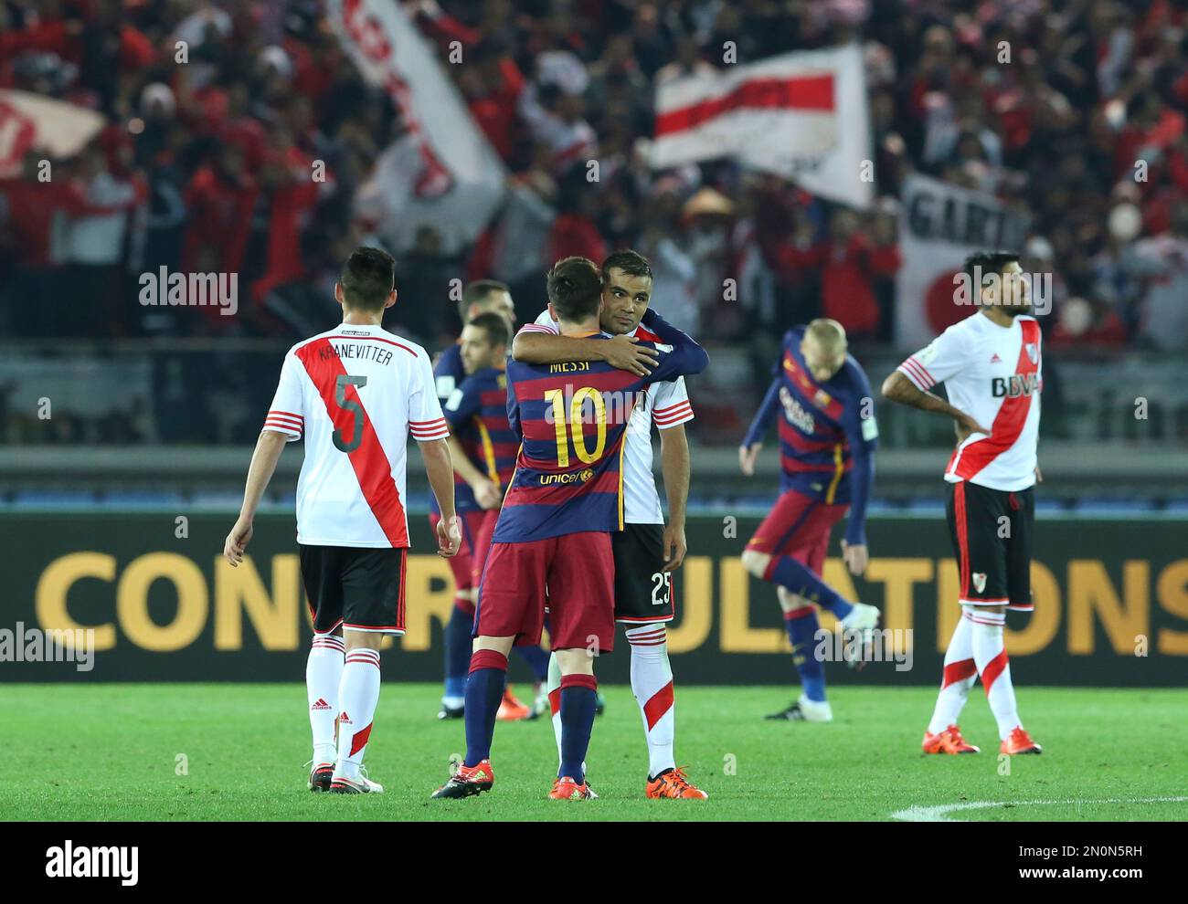 FC Barcelona’s Lionel Messi, center left, consoles River Plate’s ...