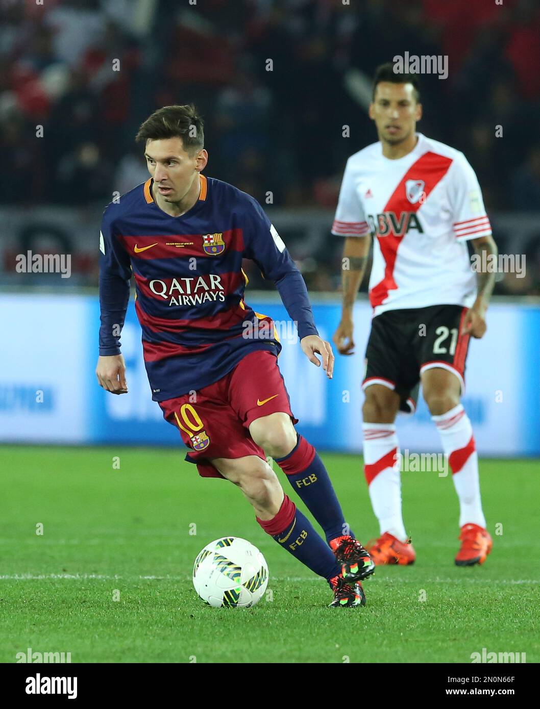 FC Barcelona’s Lionel Messi moves the ball past River Plate’s Leonel ...
