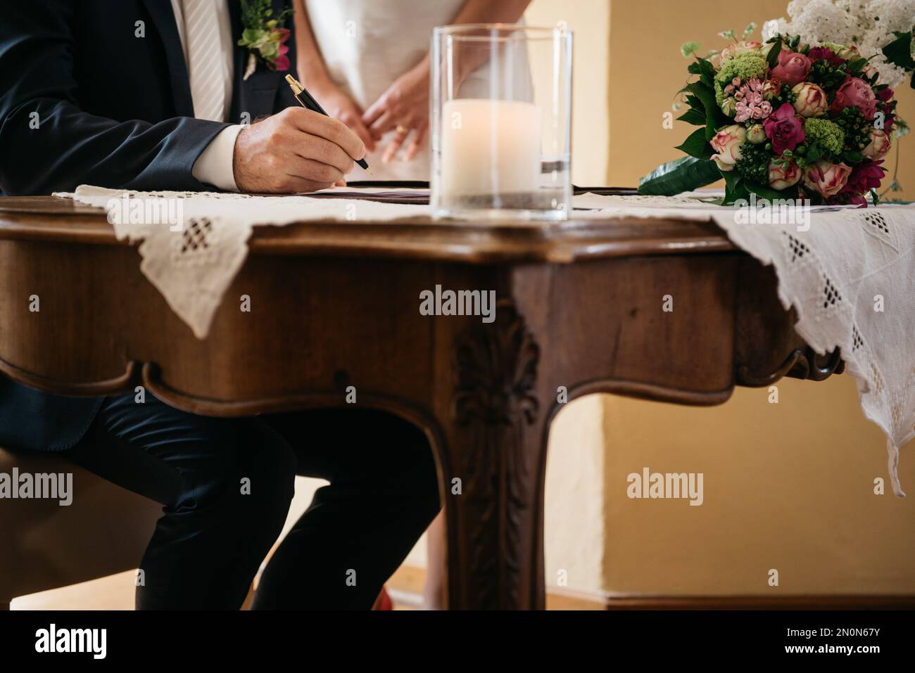 The bride and the groom signing the marriage registry Stock Photo - Alamy