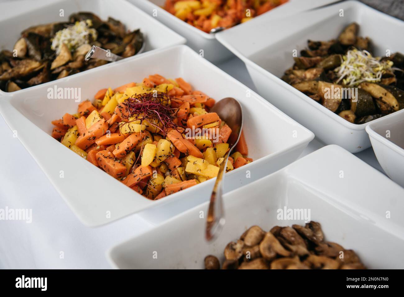 A closeup of a set of different dishes at an event table Stock Photo ...