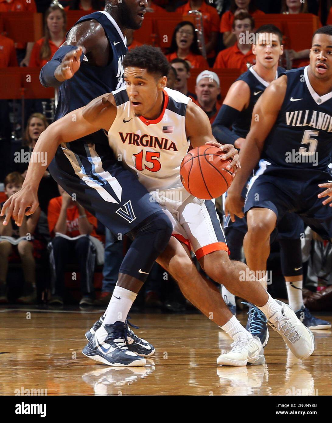 Virginia guard Malcolm Brogdon (15) runs into Villanova forward Daniel ...