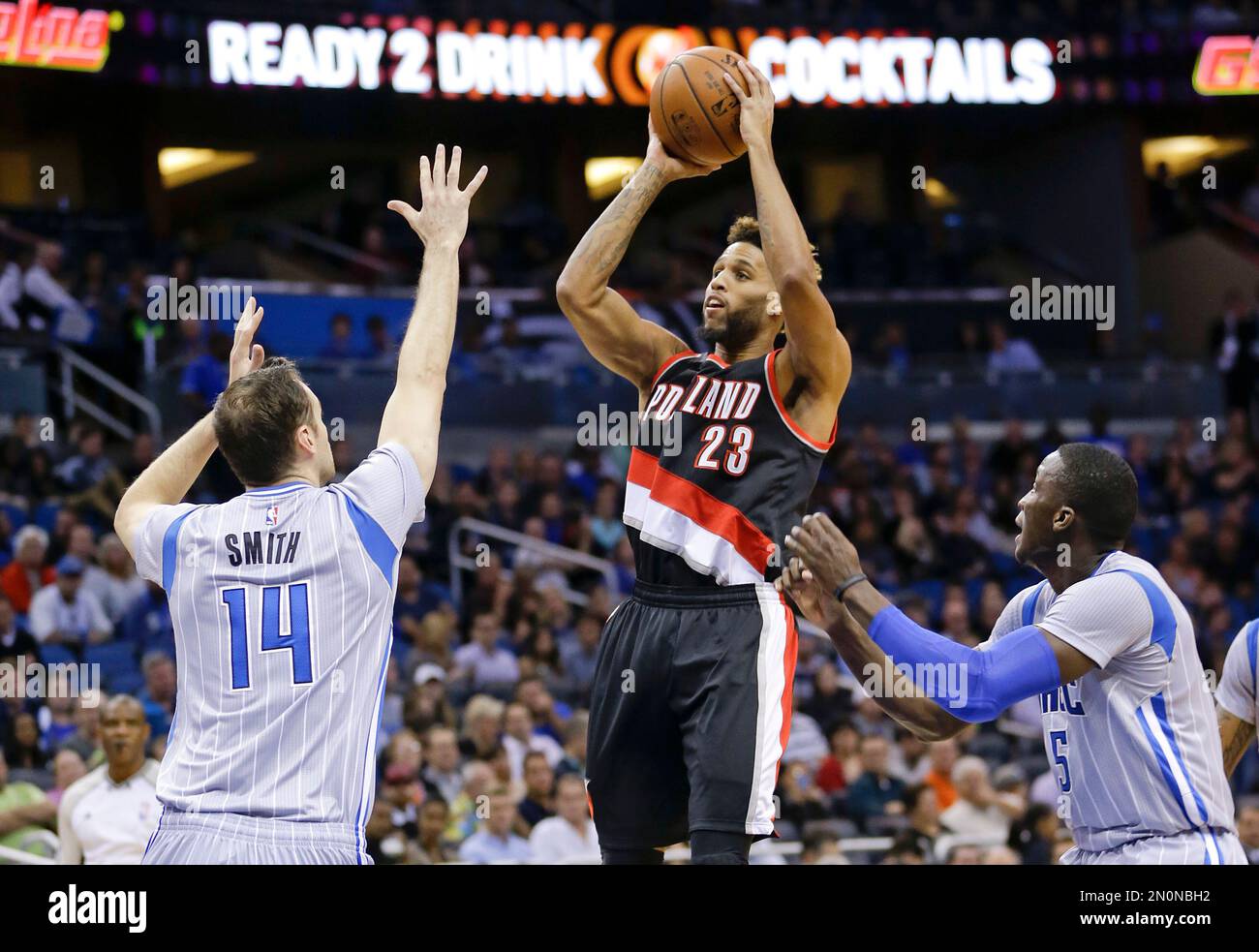 Portland Trail Blazers' Allen Crabbe (23) takes a shot between Orlando ...
