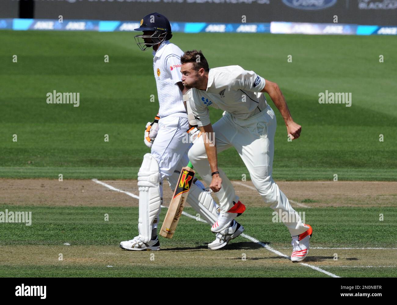 New Zealand’s Tim Southee, right, bowls past Sri Lanka’s Dushmantha ...