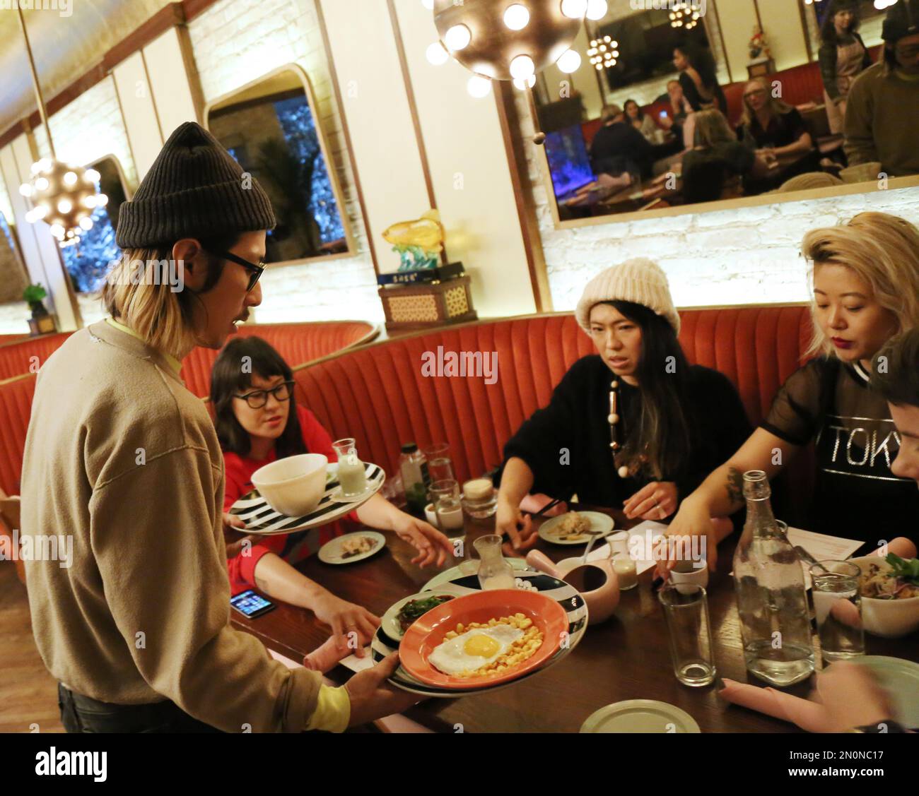 IMAGE DISTRIBUTED FOR KELLOGG'S - Chef Danny Bowien serves guests with ...