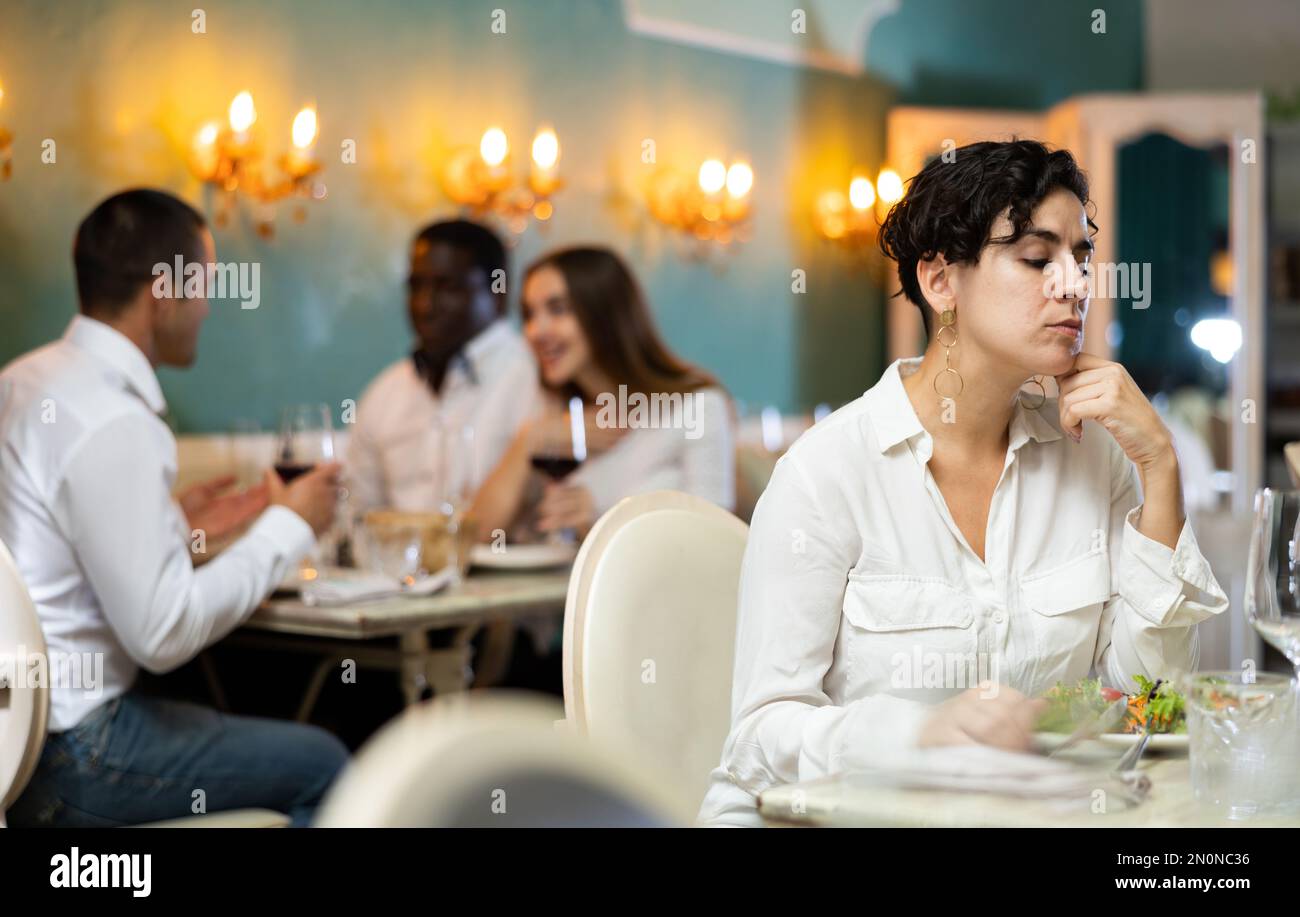 Single bored woman in the restaurant Stock Photo - Alamy