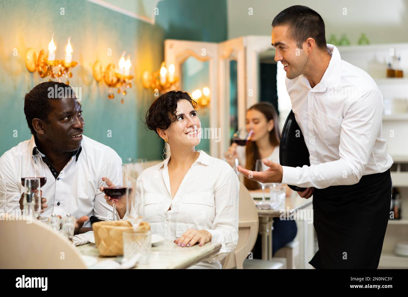 Couple offering food meal restaurant hi-res stock photography and ...