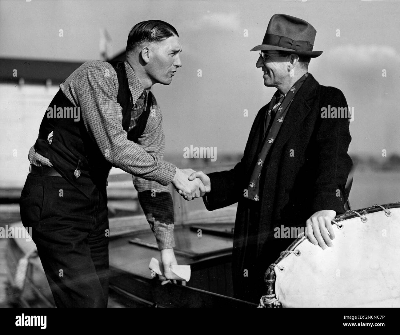 With their tongues in their cheeks coaches Al Ulbrickson, left, of the ...